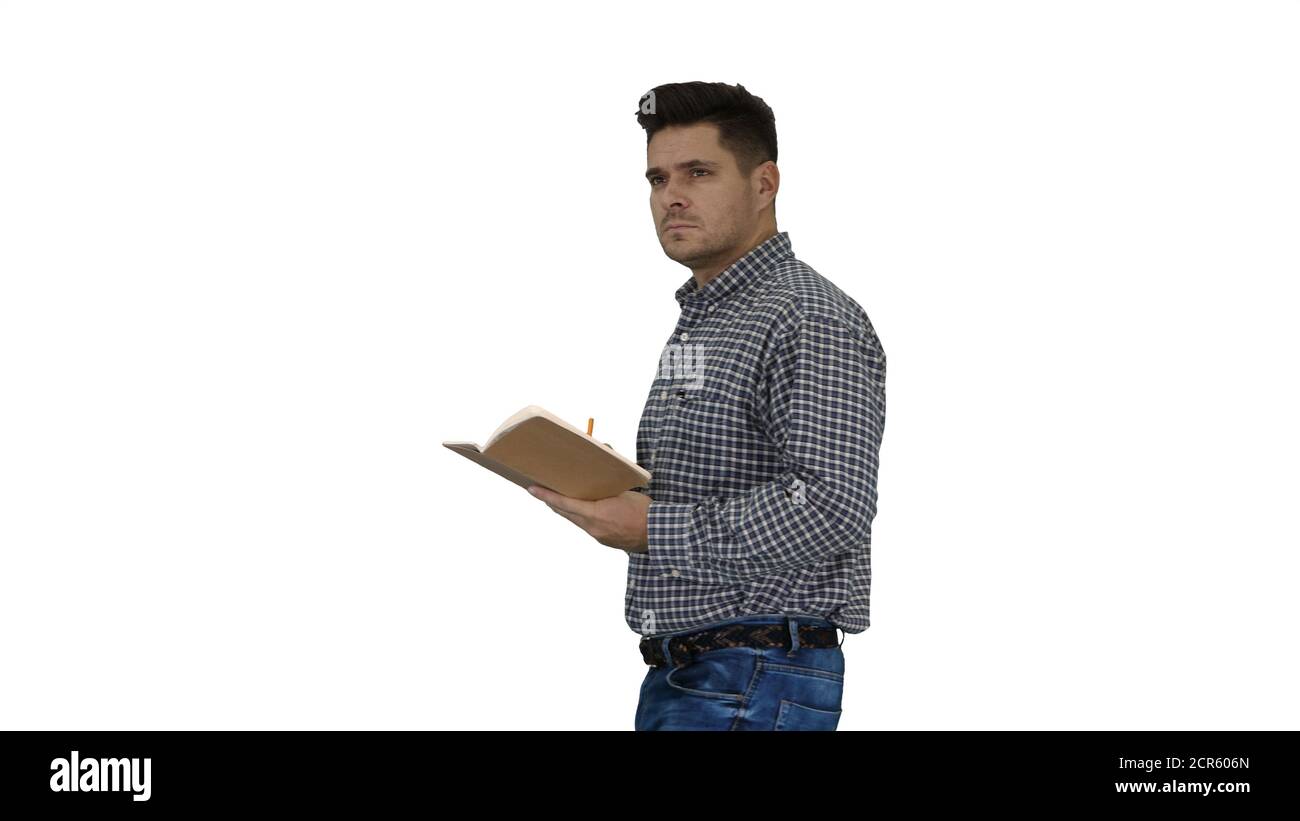 Male manager formal dressed holding notepad walking and making notes ...