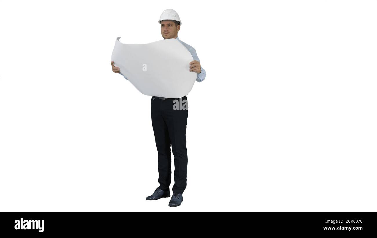 Engineer checking construction plan with what is built on white ...