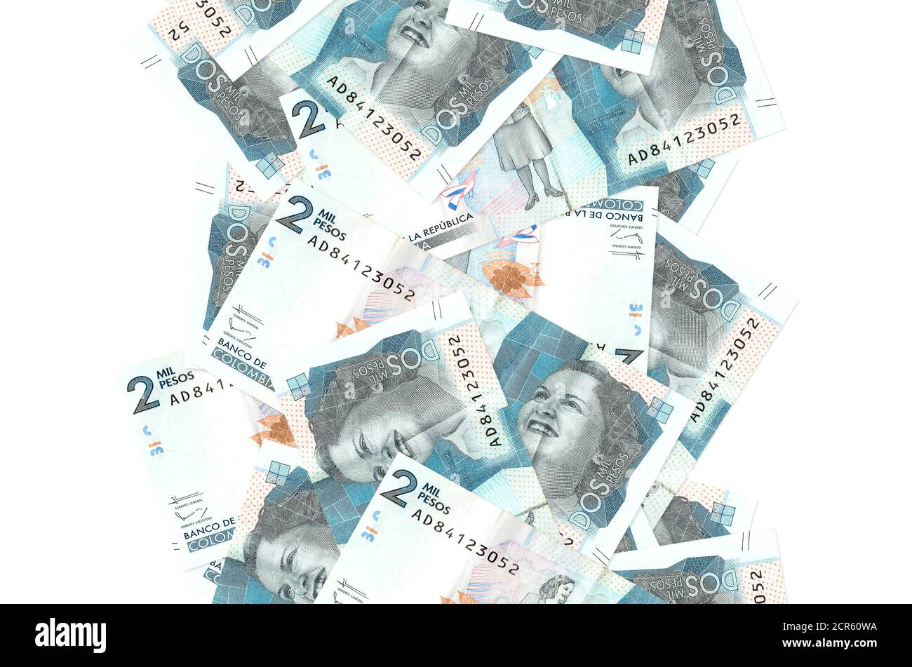 2 Colombian pesos bills flying down isolated on white. Many banknotes ...