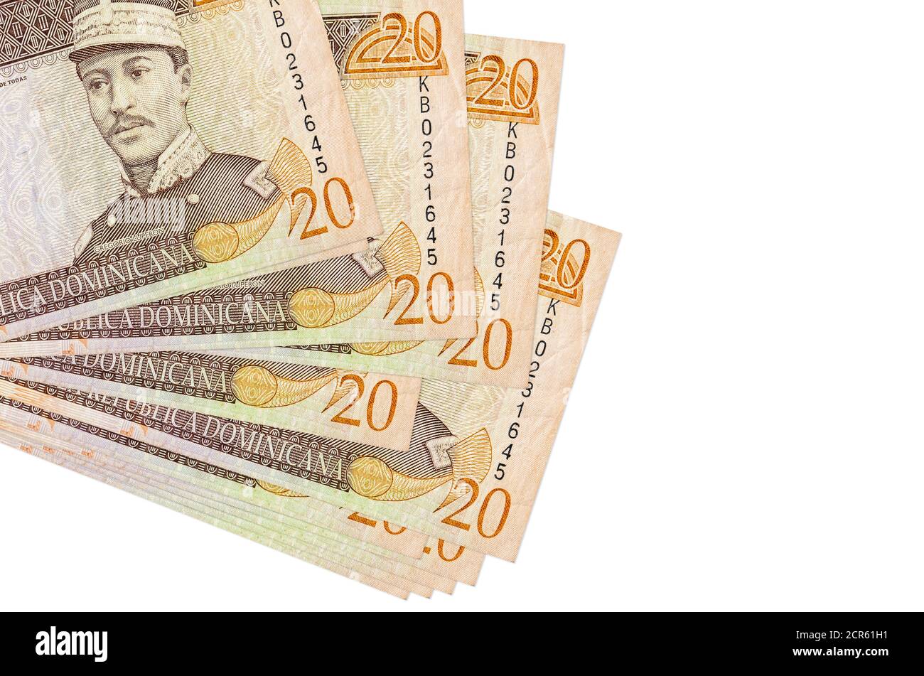 20 Dominican peso bills lies in small bunch or pack isolated on white ...