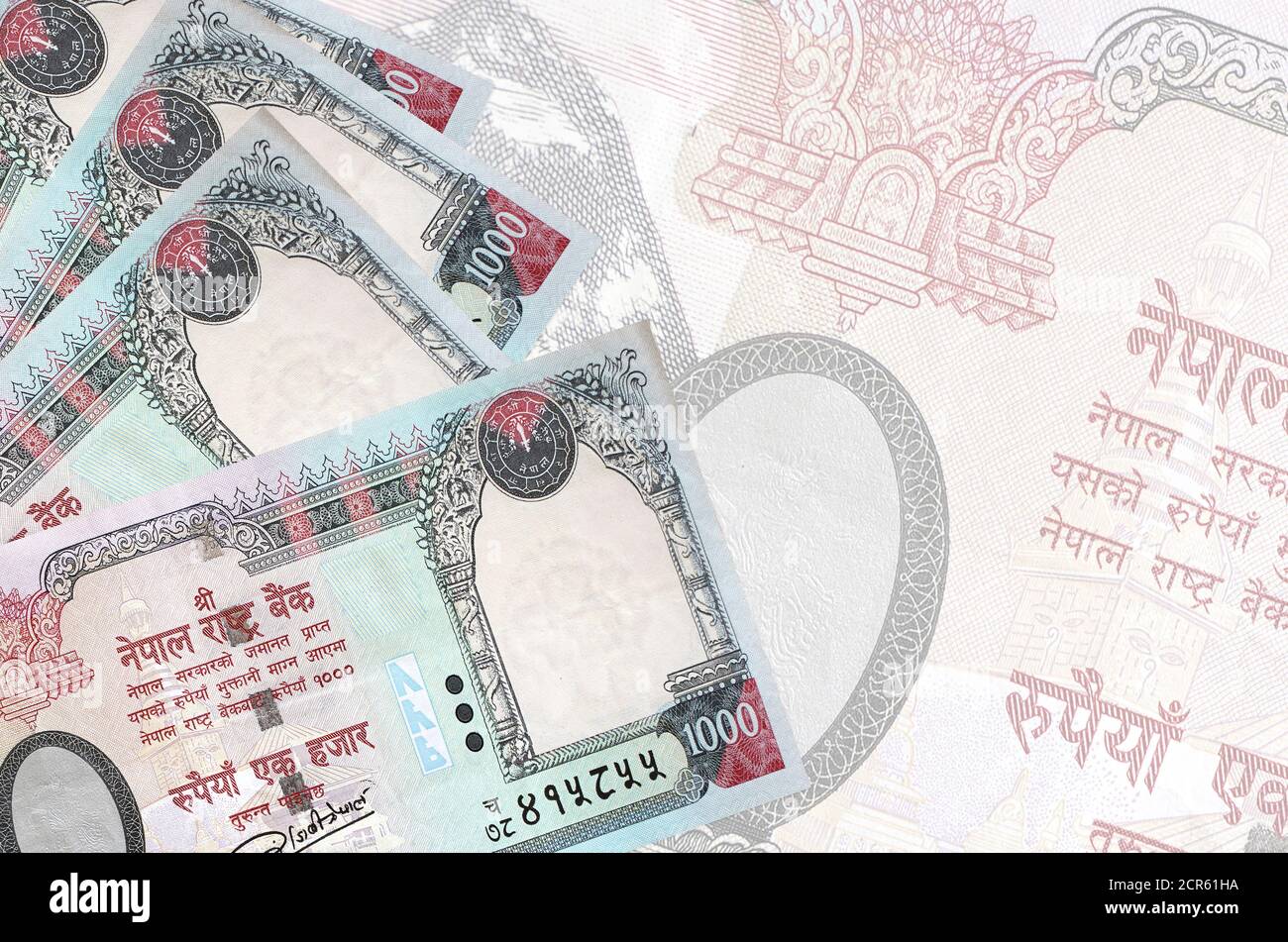 1000 Nepalese rupees bills lies in stack on background of big semi ...