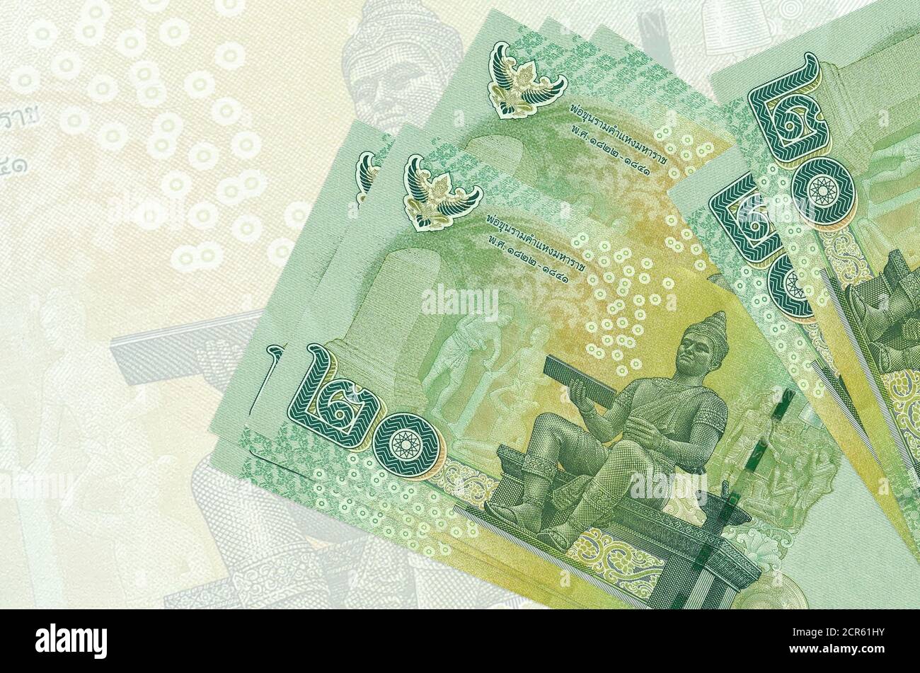 20 Thai Baht bills lies in stack on background of big semi-transparent ...