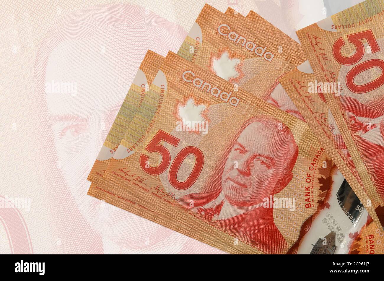 50 Canadian dollars bills lies in stack on background of big semi ...