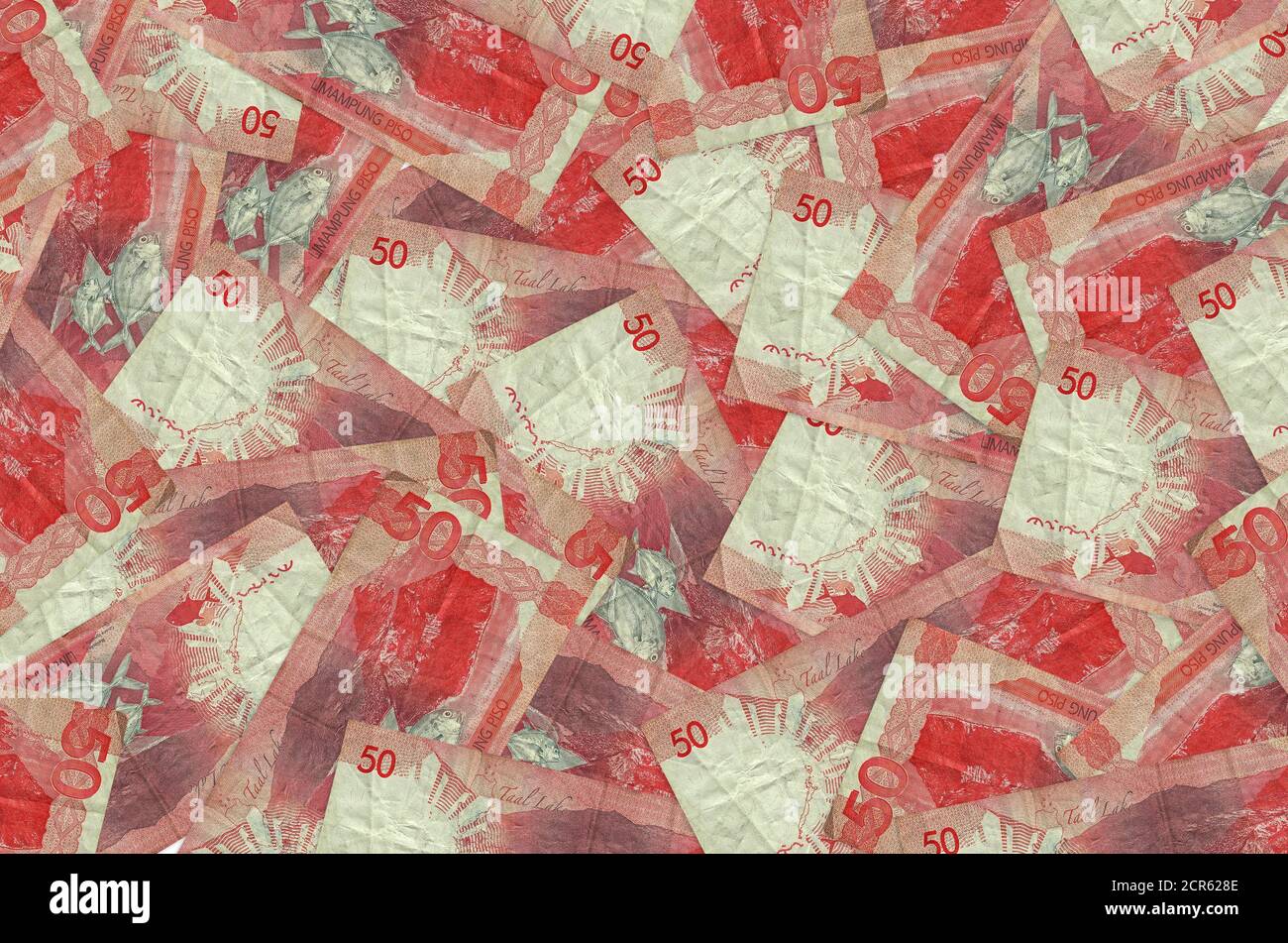50 Philippine piso bills lies in big pile. Rich life conceptual ...