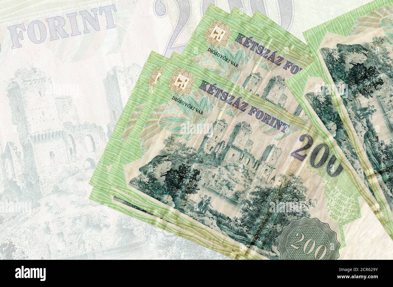 200 Hungarian forint bills lies in stack on background of big semi ...