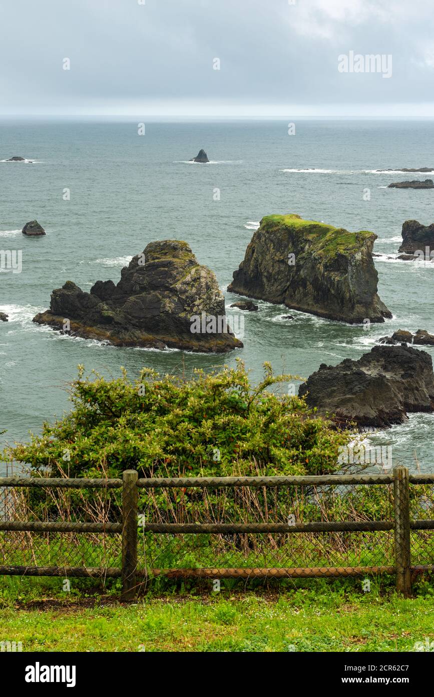 A fenced part of the Arch Rock Viewpoint overlooking rock formations in ...