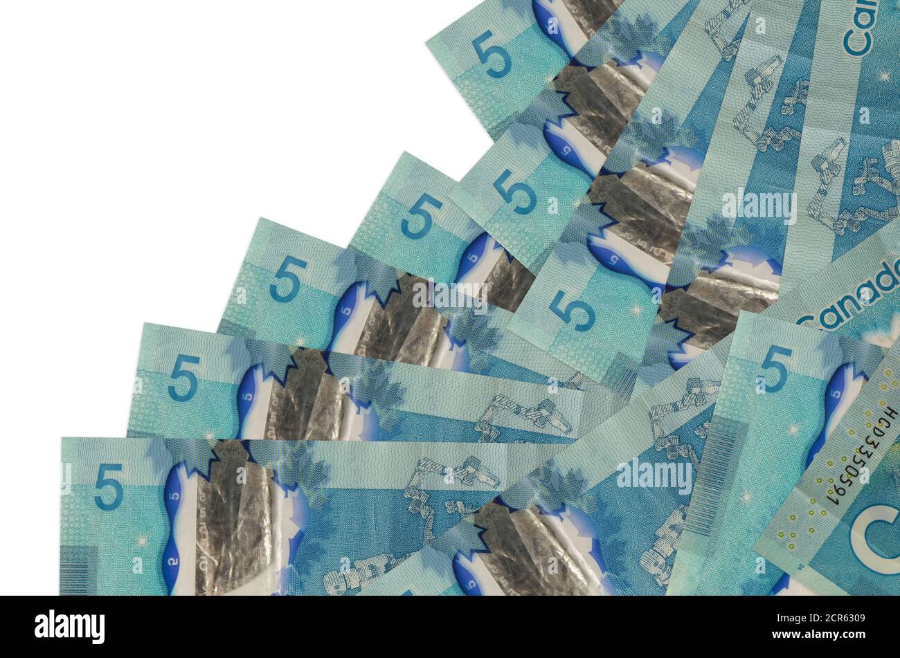 5 Canadian dollars bills lies in different order isolated on white ...