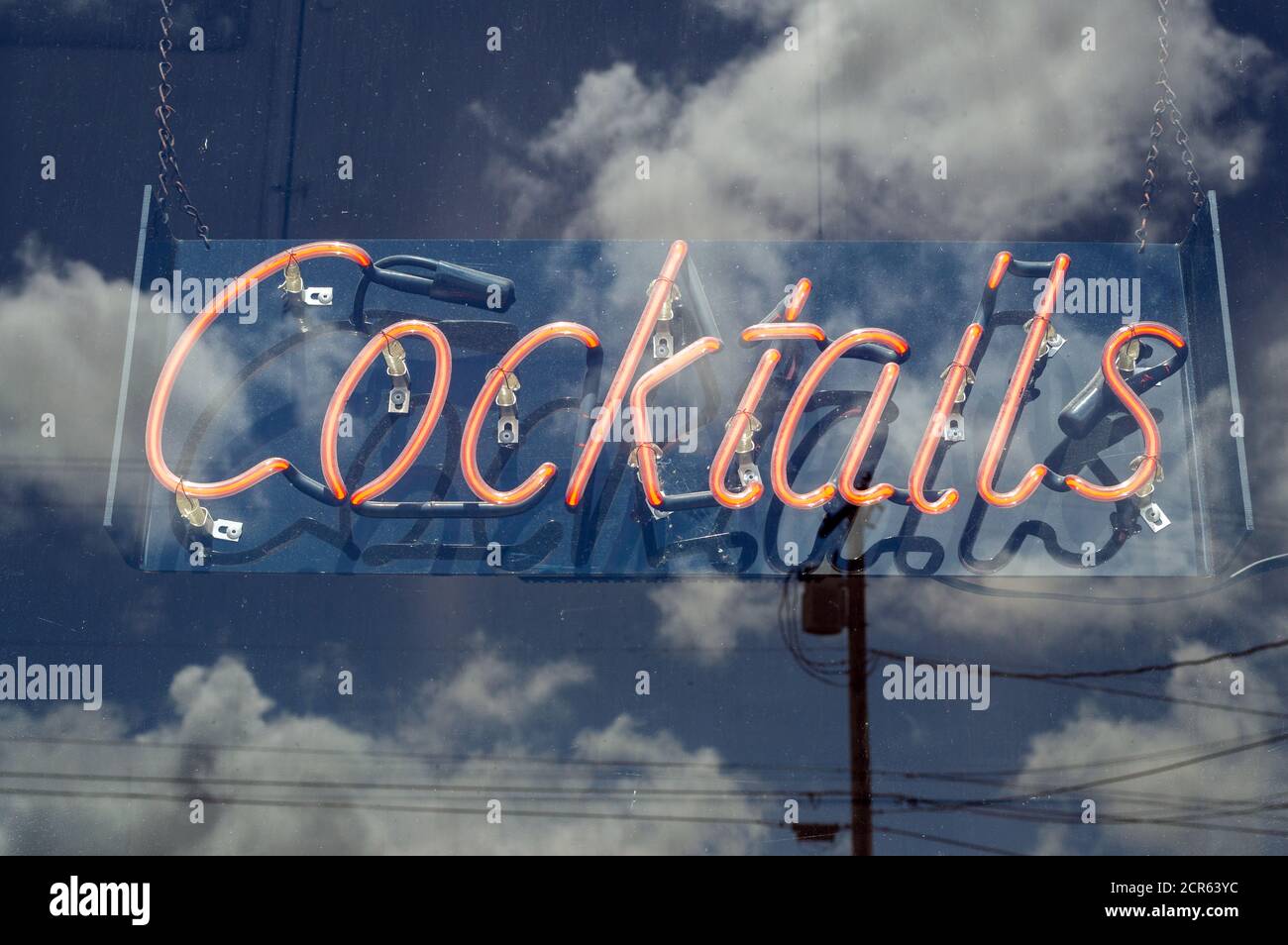 A neon cocktails sign in a window Stock Photo - Alamy