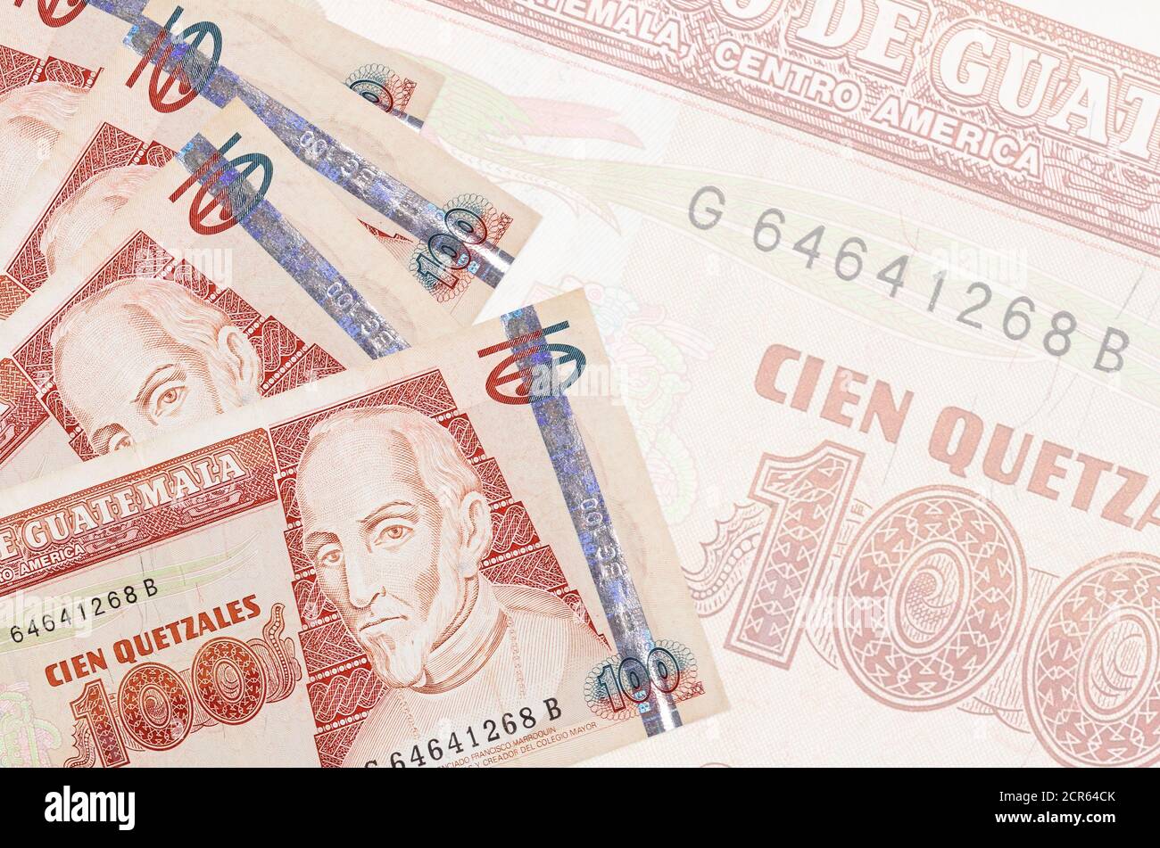 100 Guatemalan quetzales bills lies in stack on background of big semi ...
