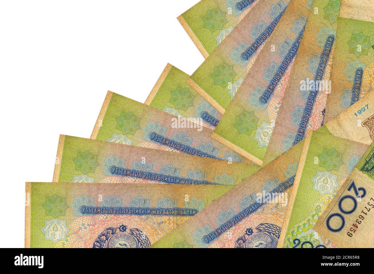 200 Uzbekistani som bills lies in different order isolated on white ...