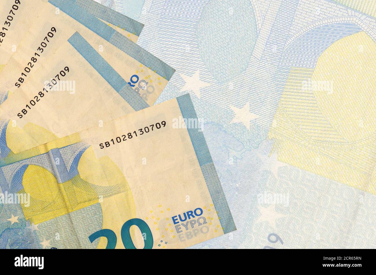 20 euro bills lies in stack on background of big semi-transparent ...