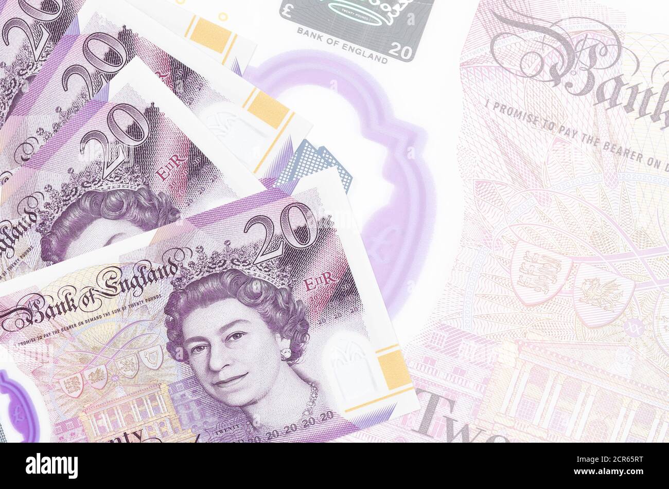 20 British pounds bills lies in stack on background of big semi ...