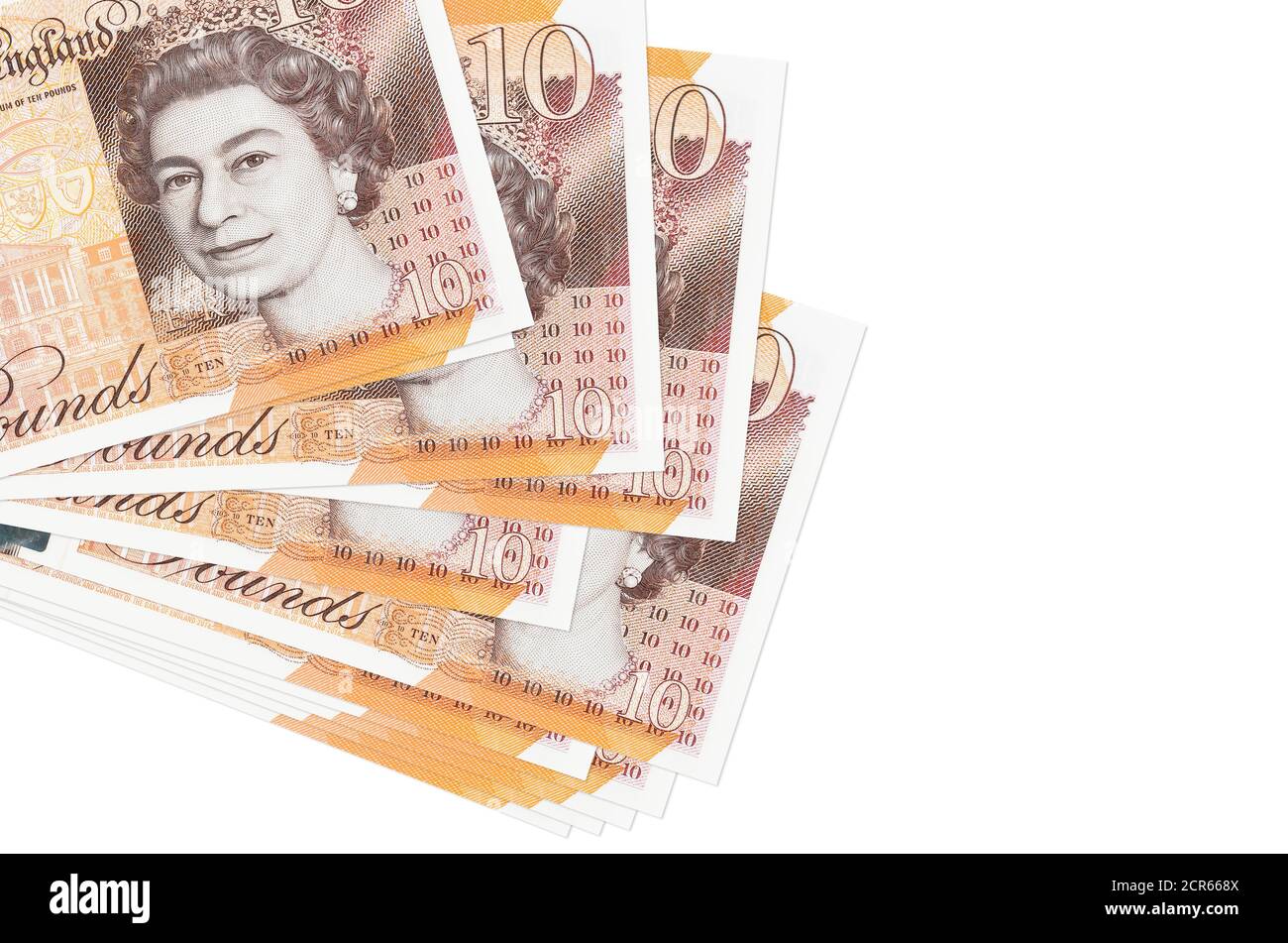 10 British pounds bills lies in small bunch or pack isolated on white ...