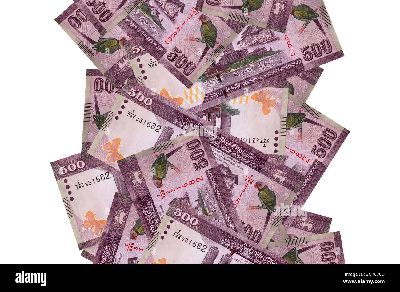 500 Sri Lankan rupees bills flying down isolated on white. Many ...