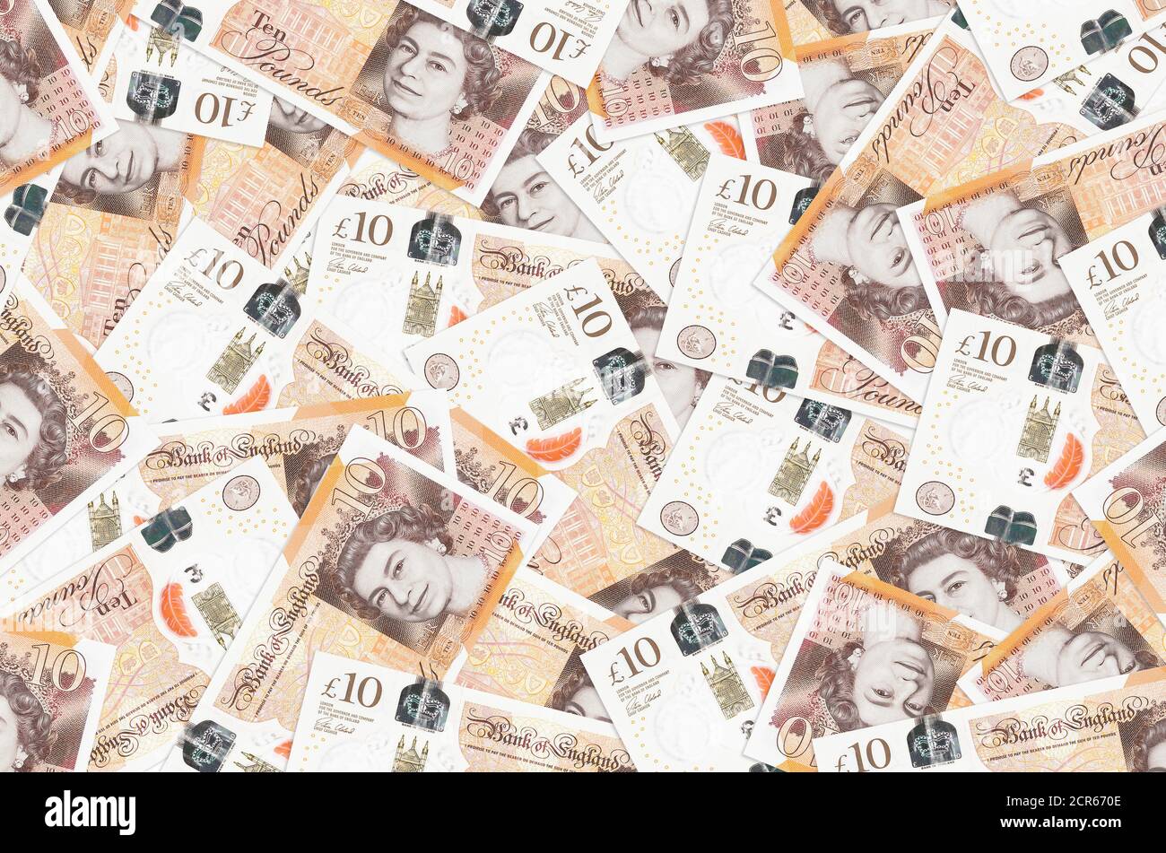 10 British pounds bills lies in big pile. Rich life conceptual ...