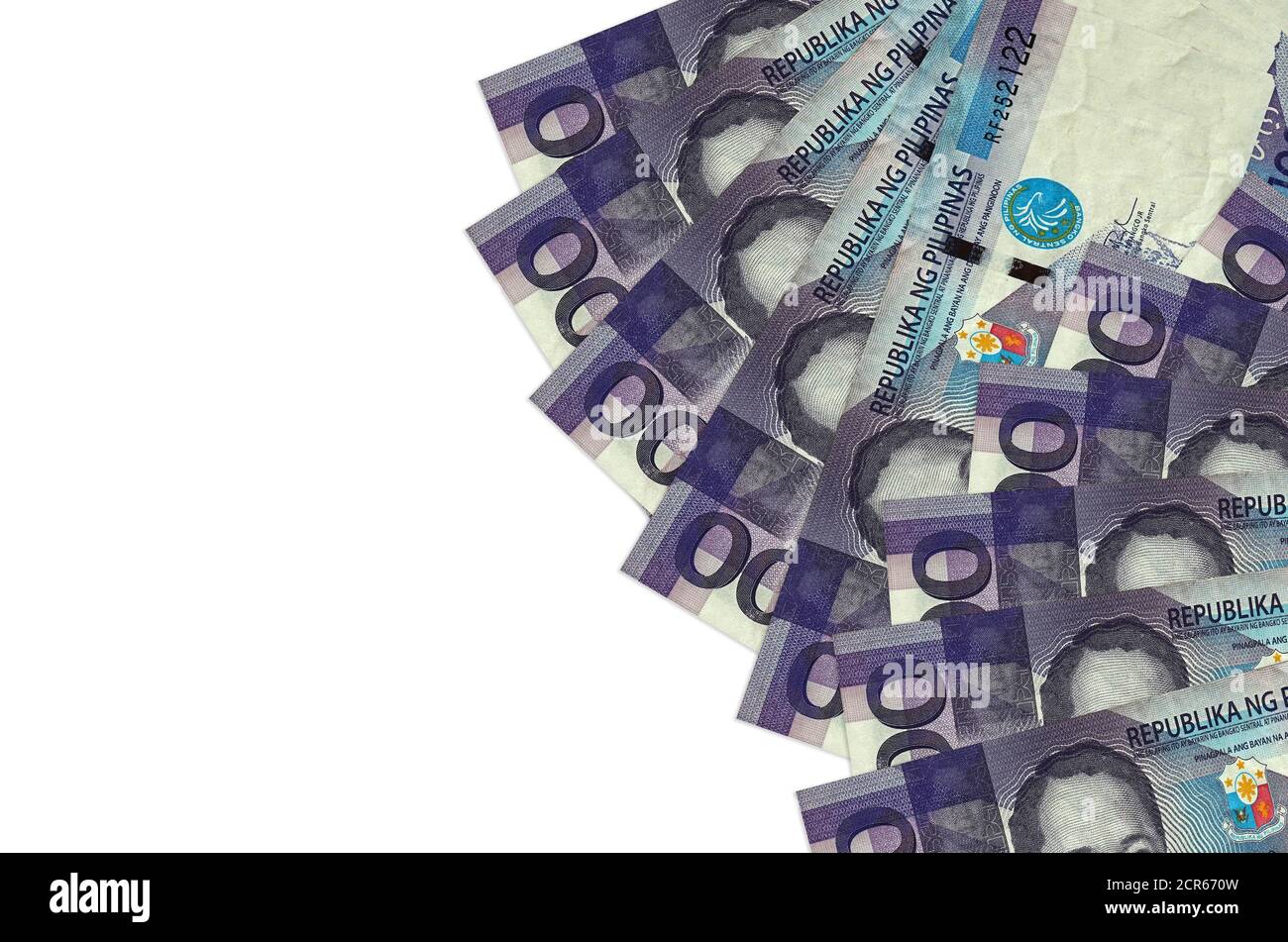 100 Philippine piso bills lies isolated on white background with copy ...