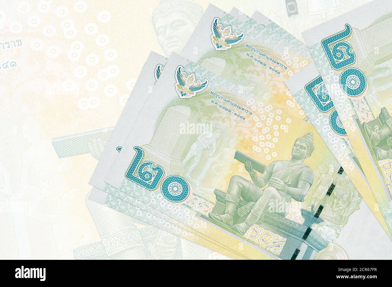 20 Thai Baht bills lies in stack on background of big semi-transparent ...
