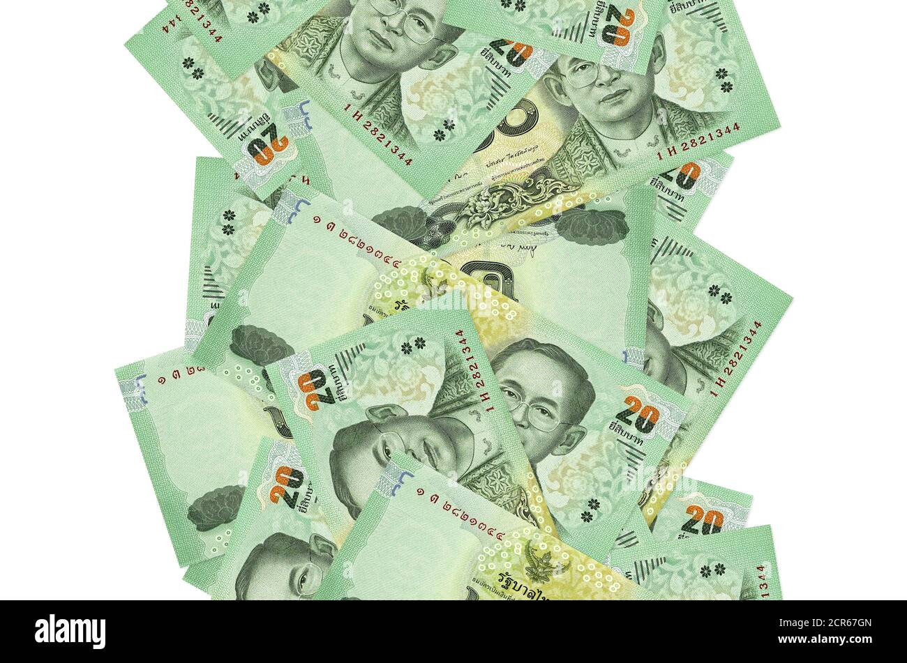 20 Thai Baht bills flying down isolated on white. Many banknotes ...