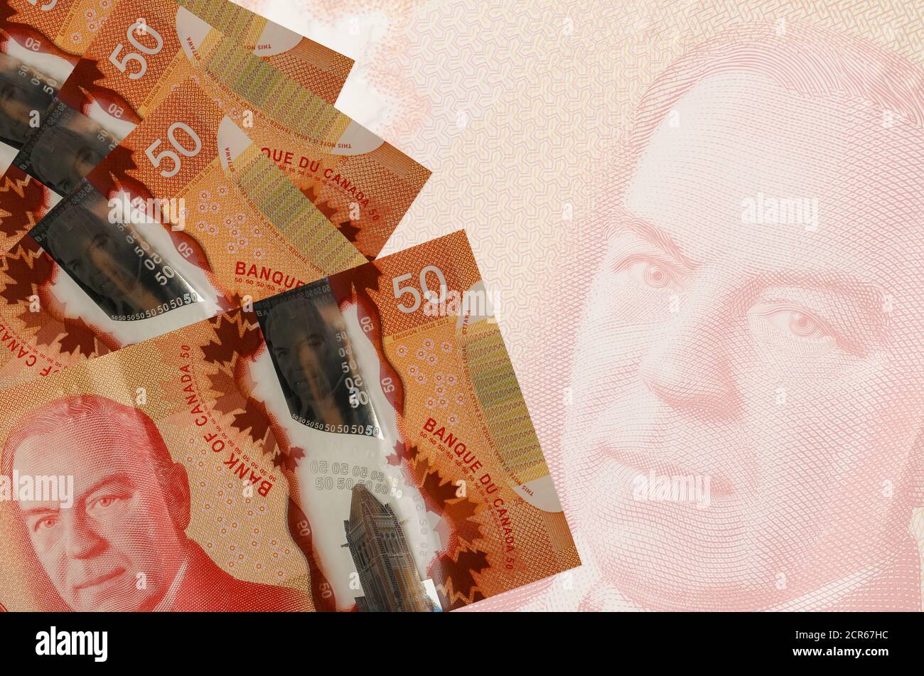 50 Canadian dollars bills lies in stack on background of big semi ...