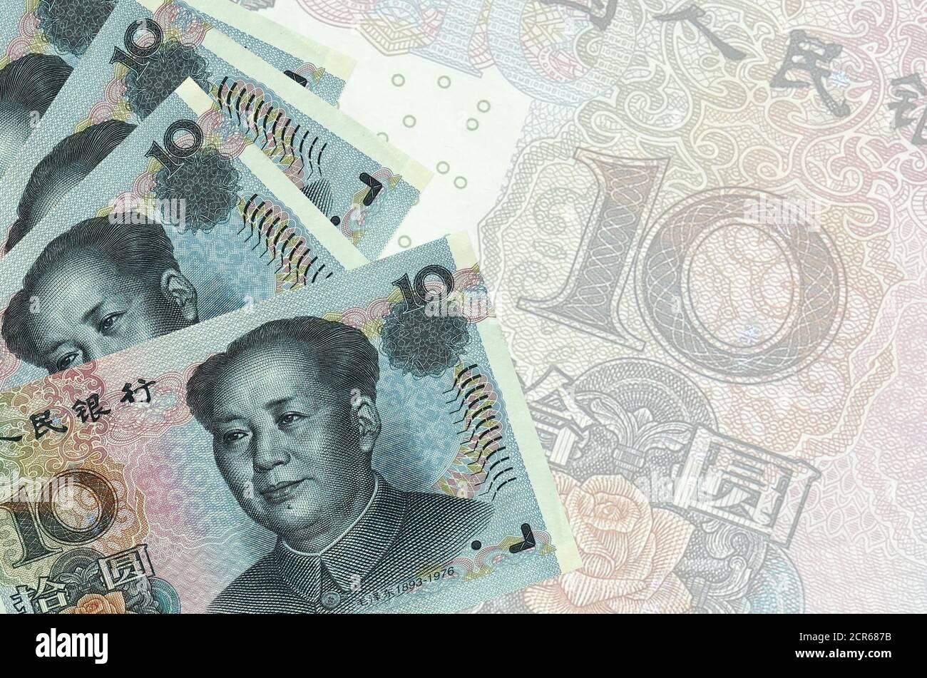 10 Chinese yuan bills lies in stack on background of big semi ...