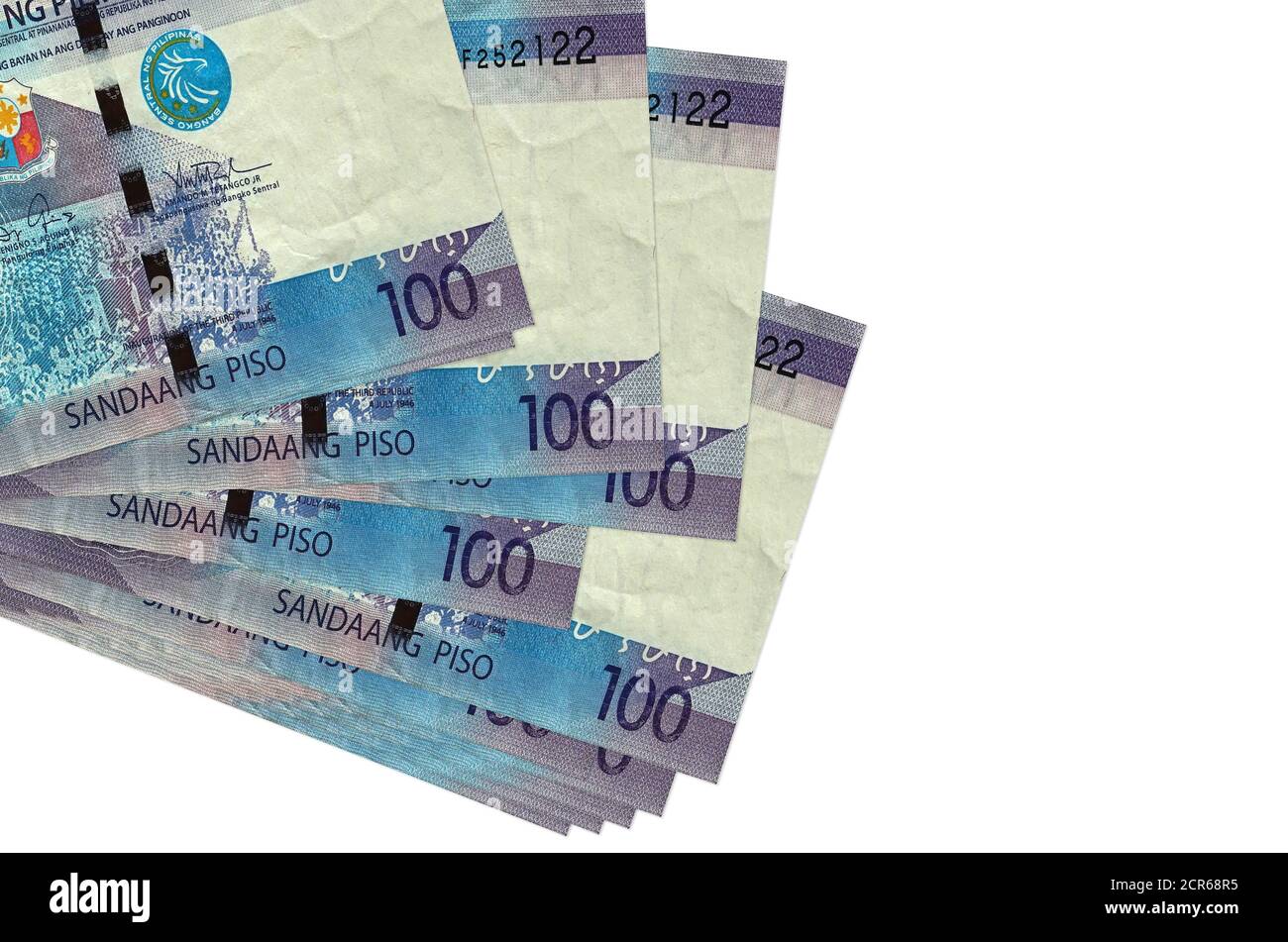100 Philippine piso bills lies in small bunch or pack isolated on white ...