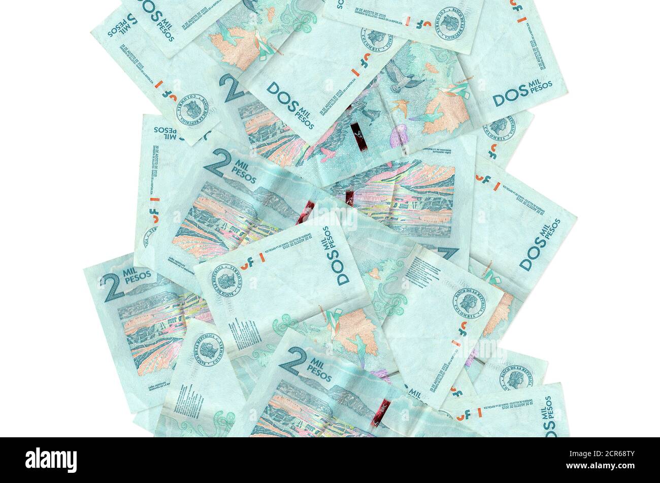 2 Colombian pesos bills flying down isolated on white. Many banknotes ...