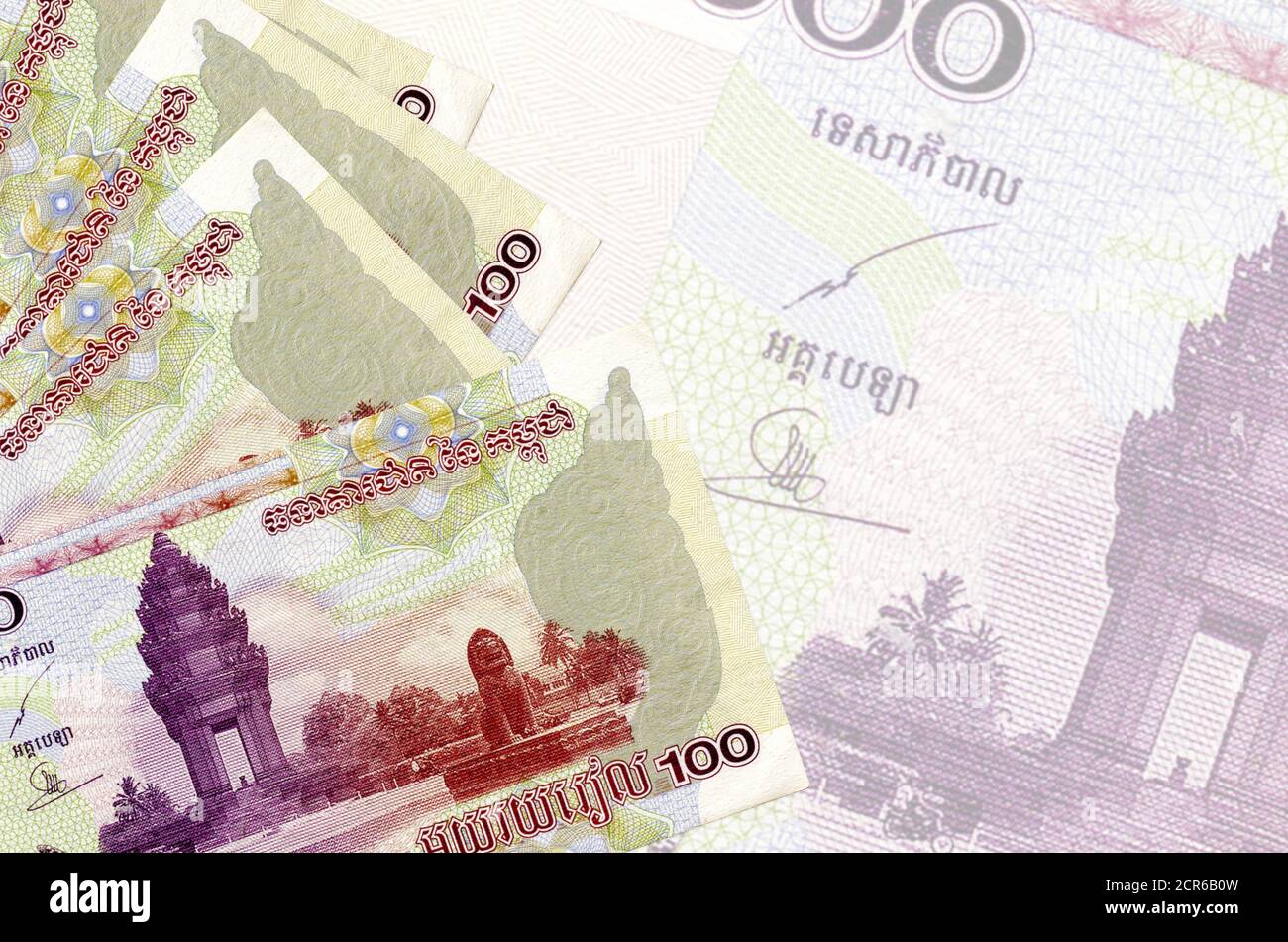 100 Cambodian riels bills lies in stack on background of big semi ...
