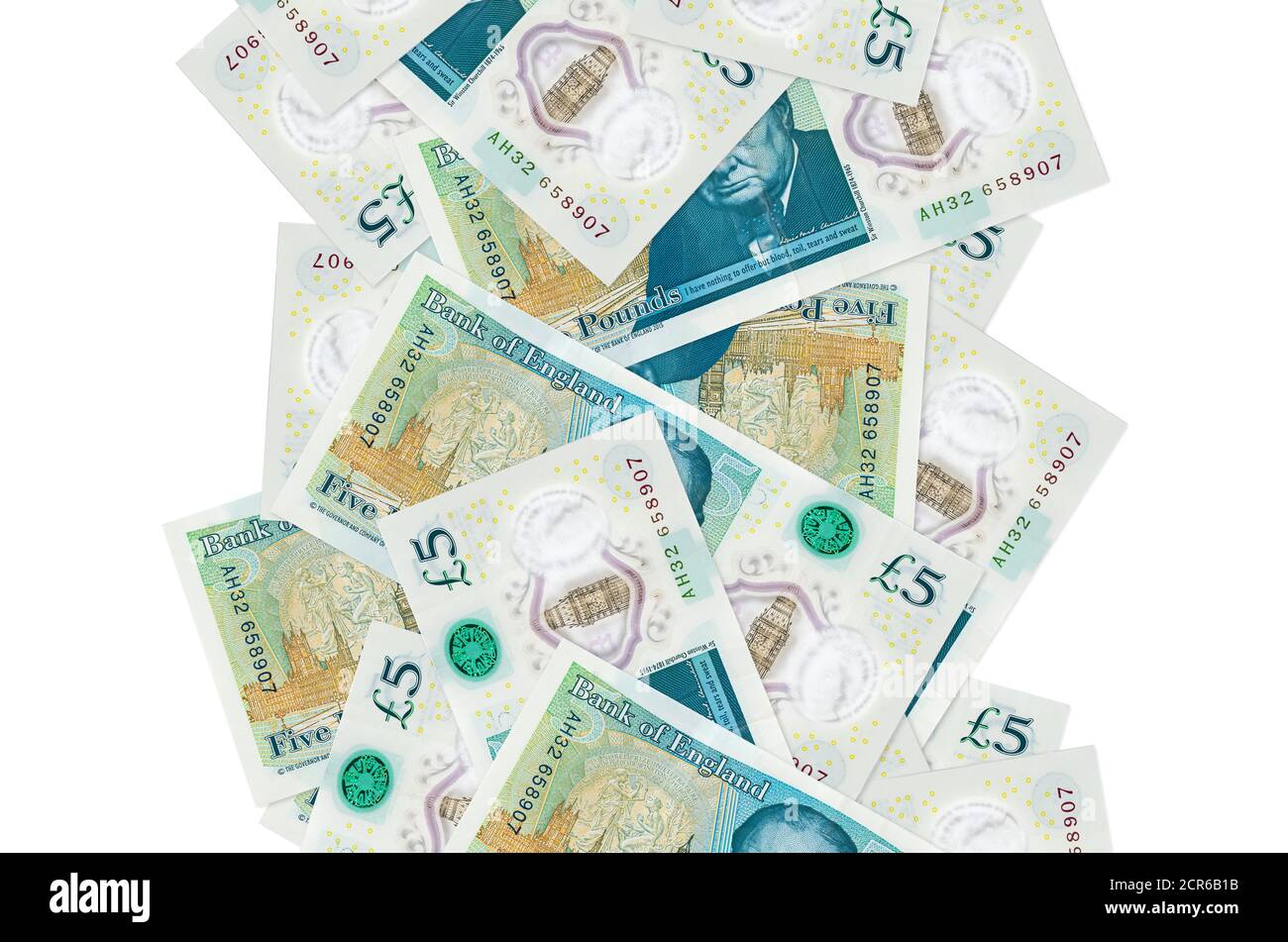 5 British pounds bills flying down isolated on white. Many banknotes ...
