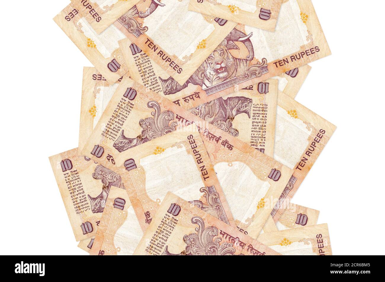 10 Indian rupees bills flying down isolated on white. Many banknotes ...