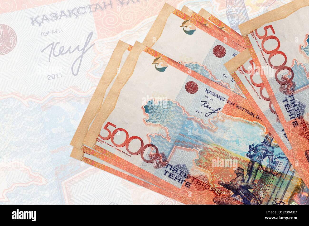 5000 Kazakhstani tenge bills lies in stack on background of big semi ...