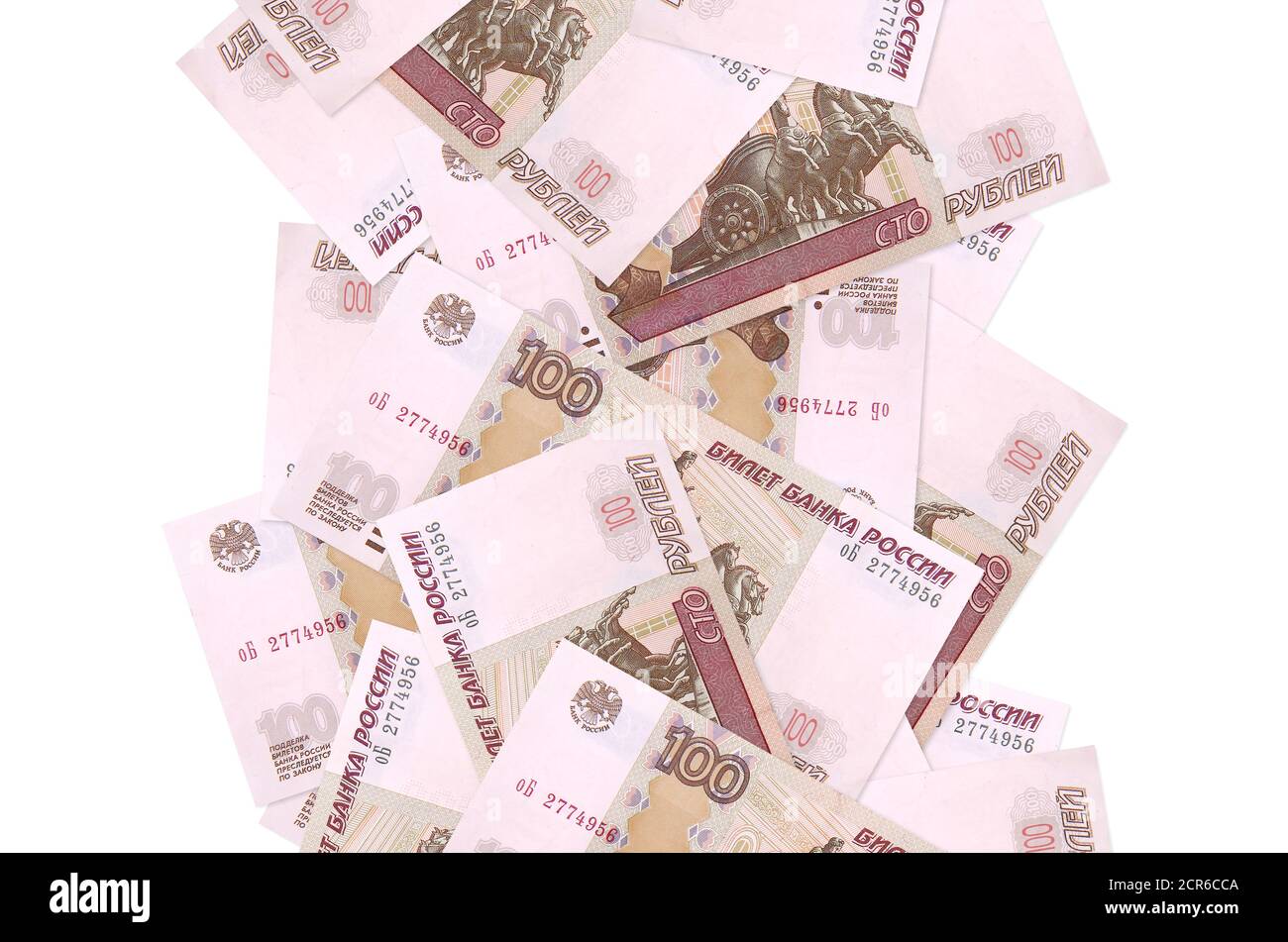 100 russian rubles bills flying down isolated on white. Many banknotes ...
