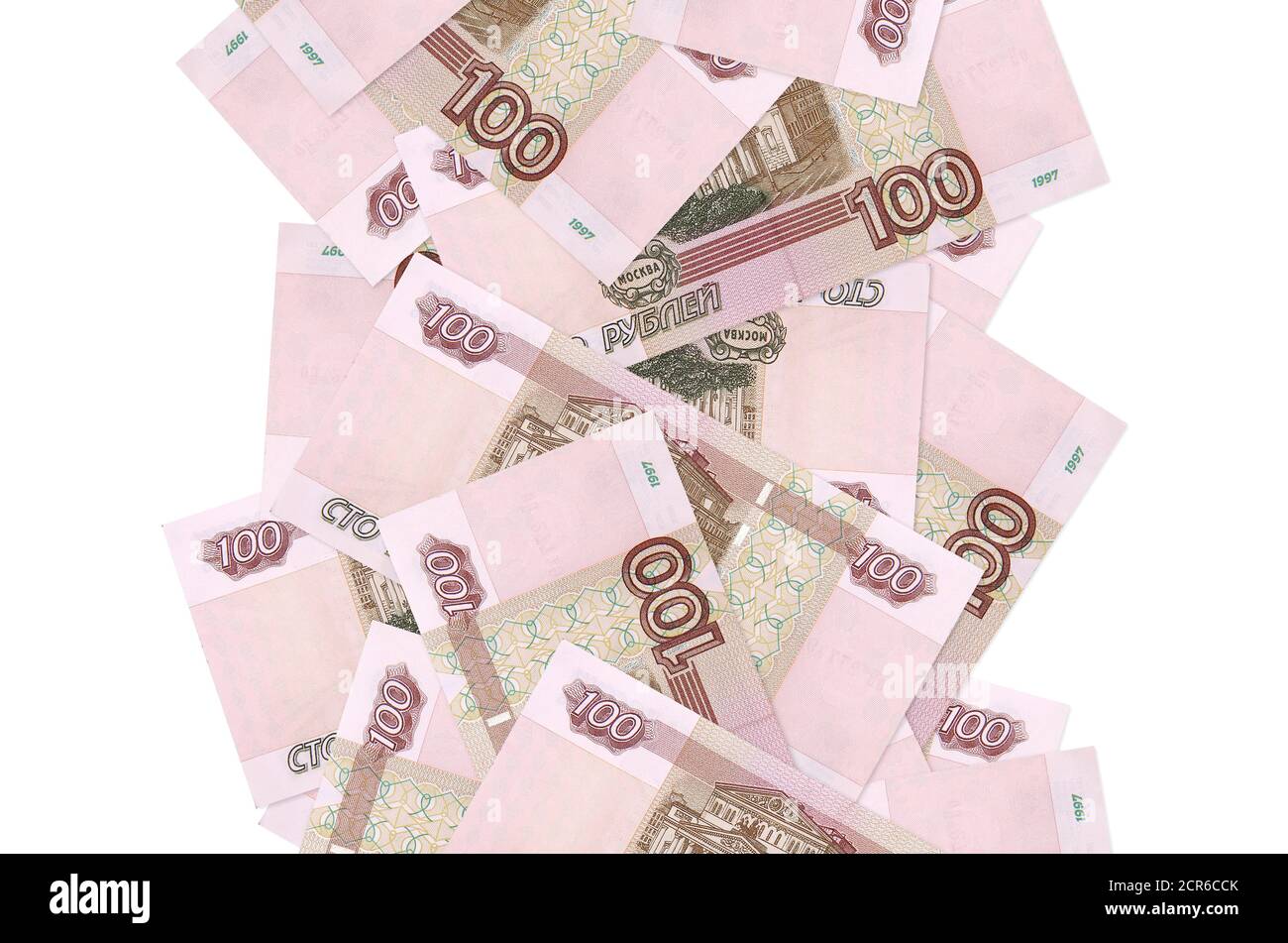 100 russian rubles bills flying down isolated on white. Many banknotes ...