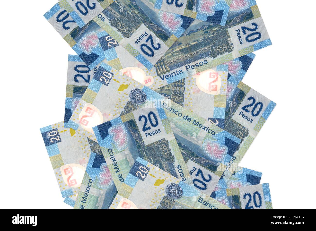 20 Mexican pesos bills flying down isolated on white. Many banknotes ...