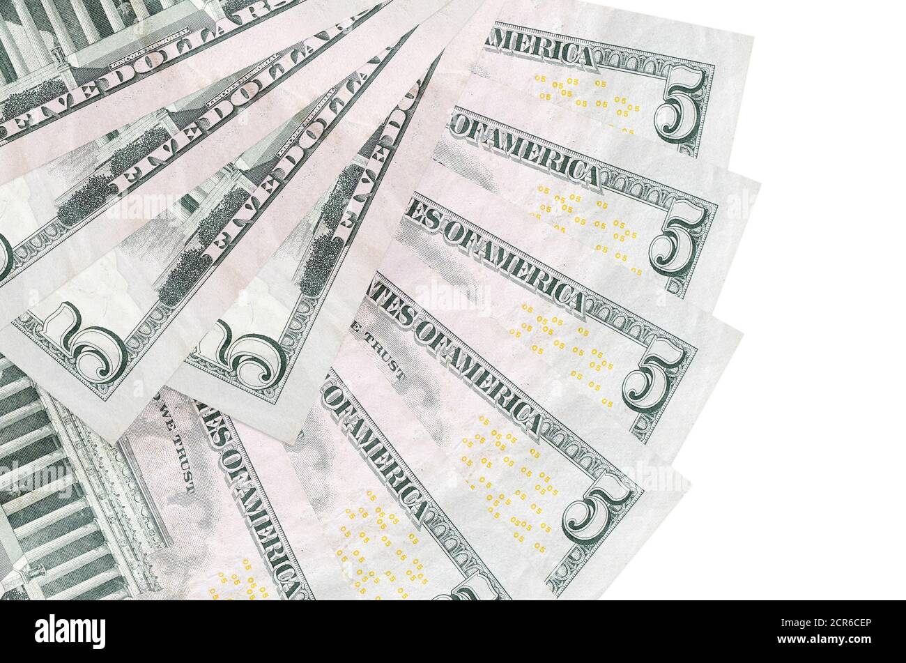 5 US dollars bills lies isolated on white background with copy space ...