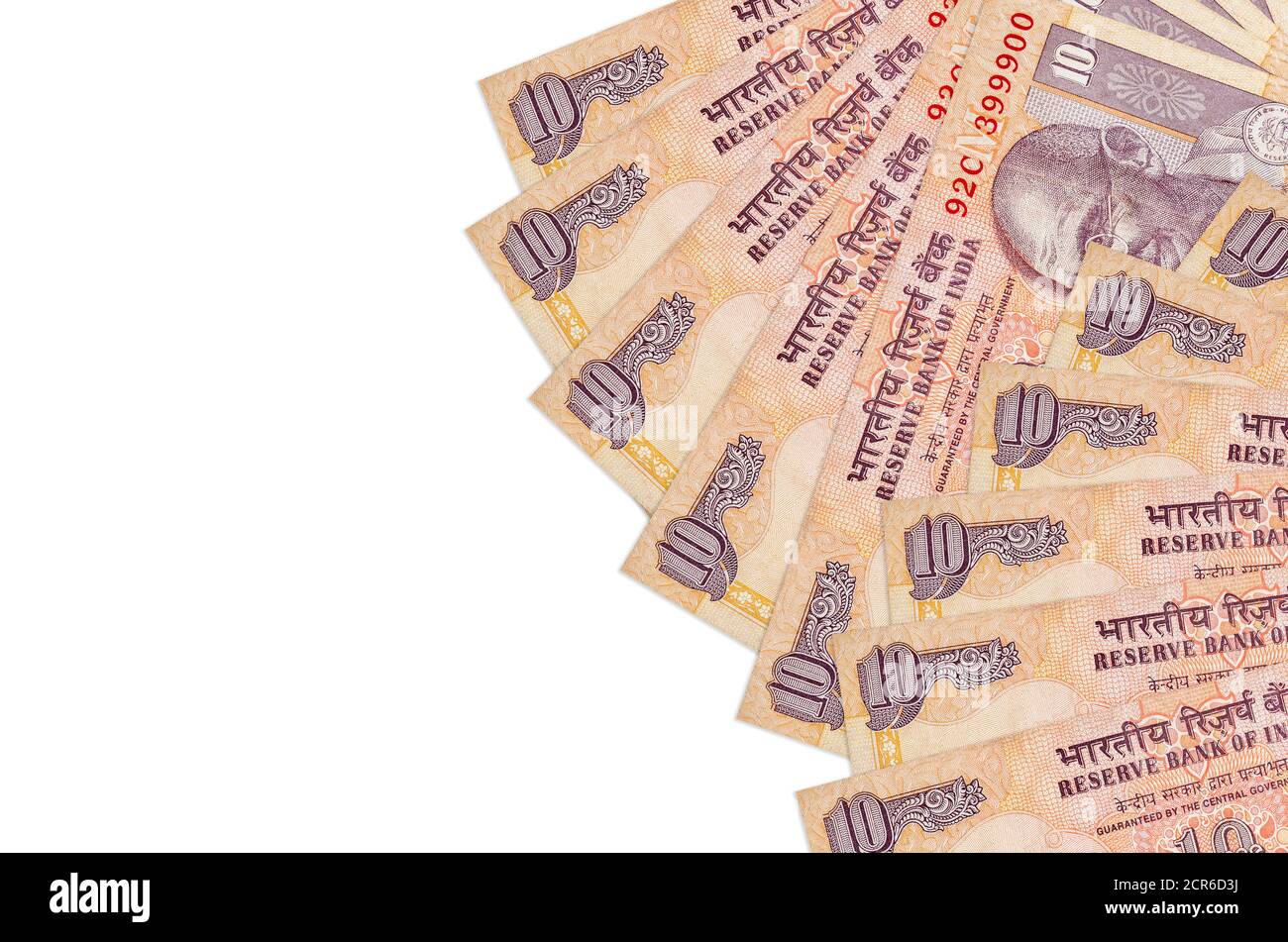 10 Indian rupees bills lies isolated on white background with copy ...