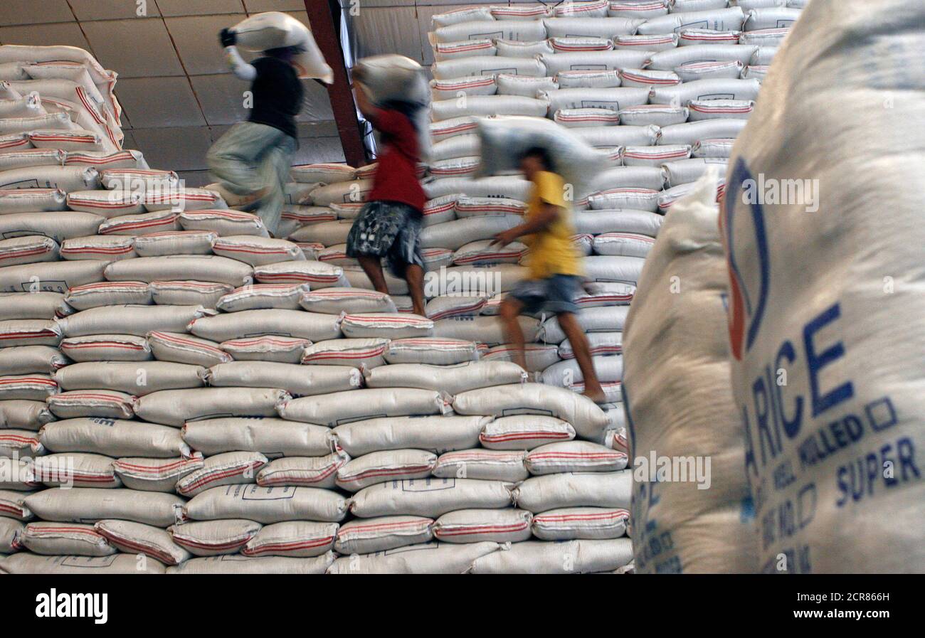 Man carrying sack rice on hi-res stock photography and images - Alamy
