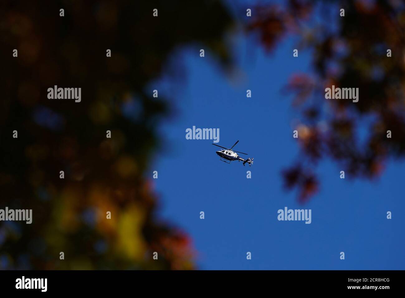Police helicopter flies hi-res stock photography and images - Alamy