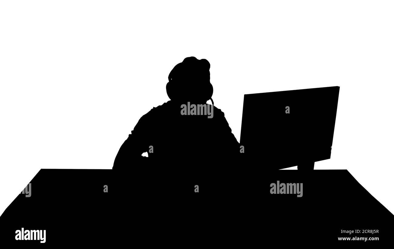 Silhouette Young man gamer having a video call on pc Stock Photo - Alamy