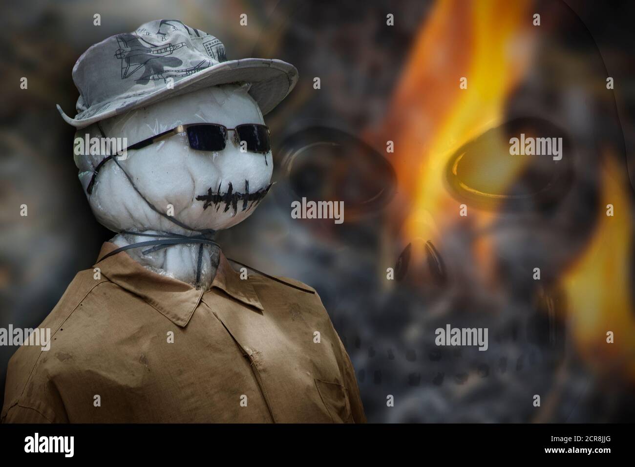 Scarecrow with skull and fire on background for halloween Stock Photo ...