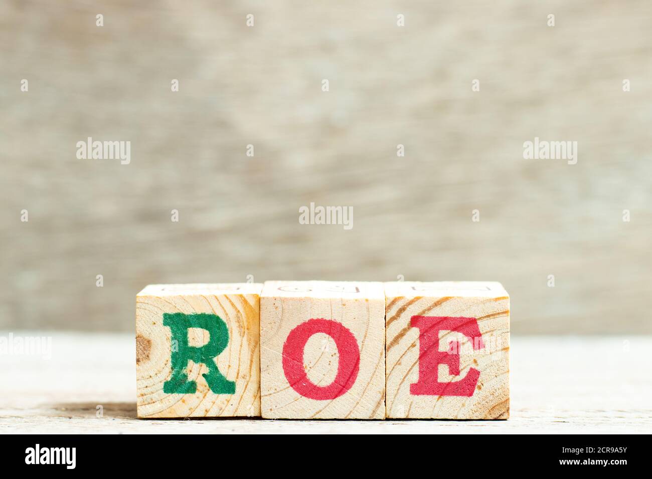 Alphabet letter in word ROE (Abbreviation of Return on equity) on wood ...