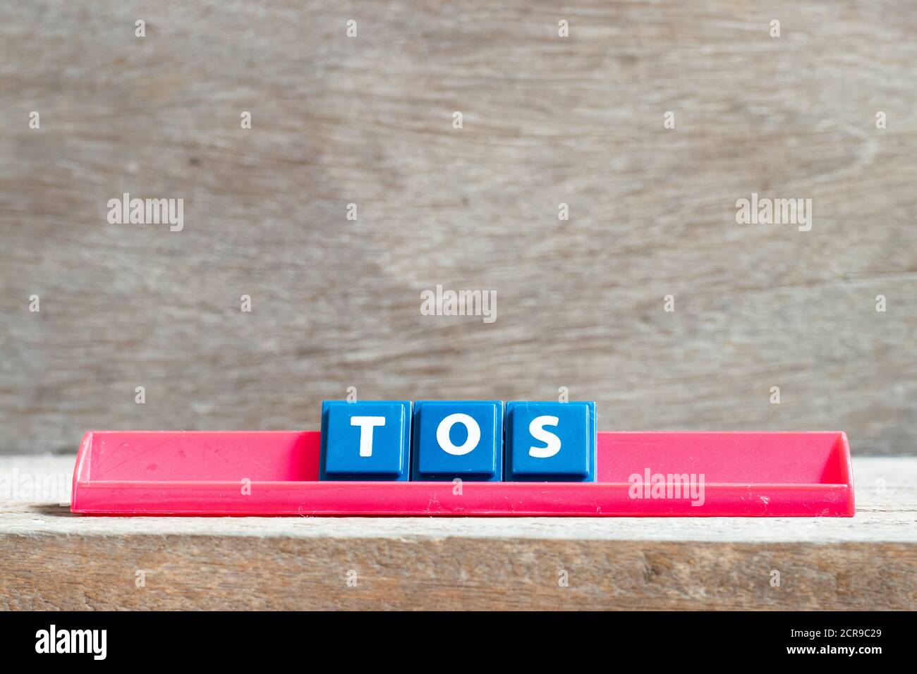 Tile letter on red rack in word TOS (abbreviation of Terms of service ...