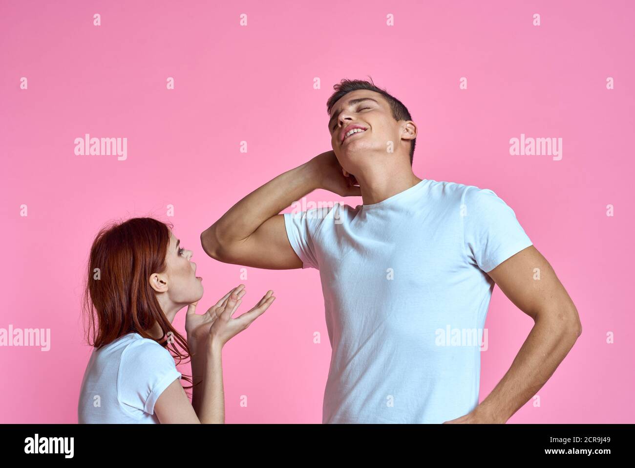 enamored man and woman hugging each other on a pink background cropped ...