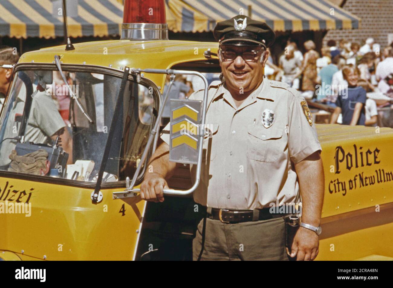 Parking Meter Checker Stands by His Police Vehicle Which Is Imprinted ...