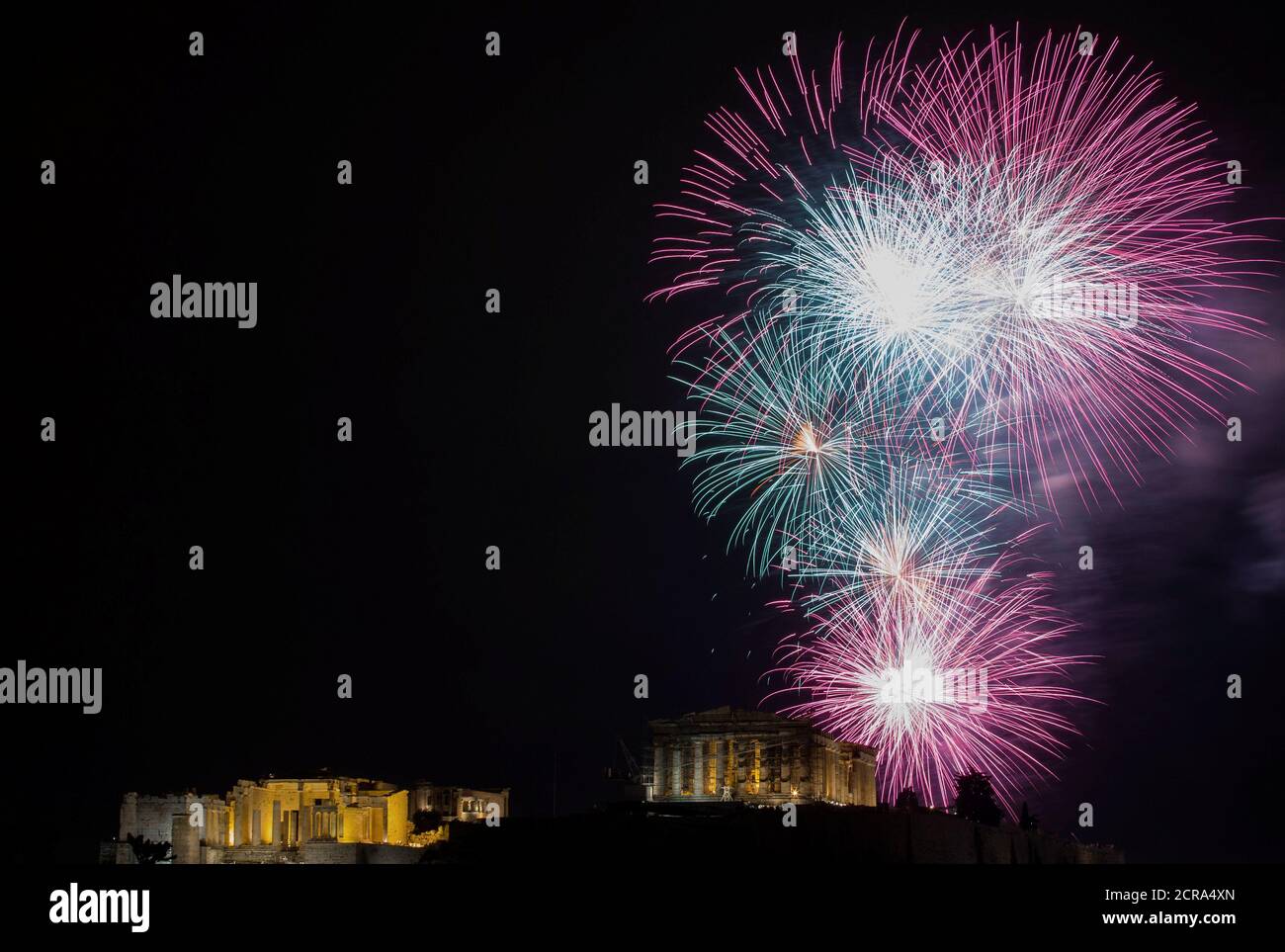 Fireworks explode over the ancient parthenon temple at the acropolis hi ...