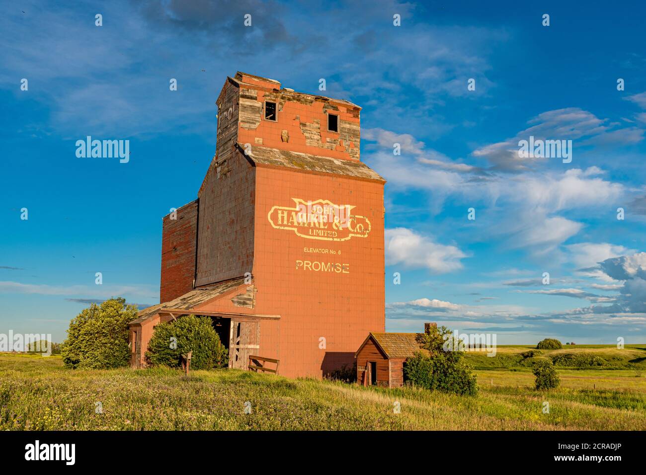 Brooking, SK- July 18, 2020: Sunset over the abandoned grain elevator ...