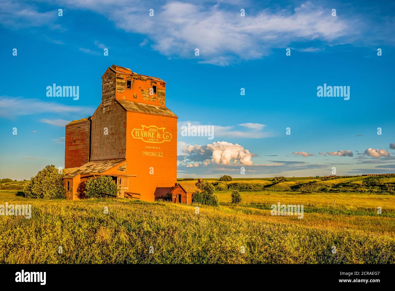 Brooking, SK- July 18, 2020: Sunset over the abandoned grain elevator ...