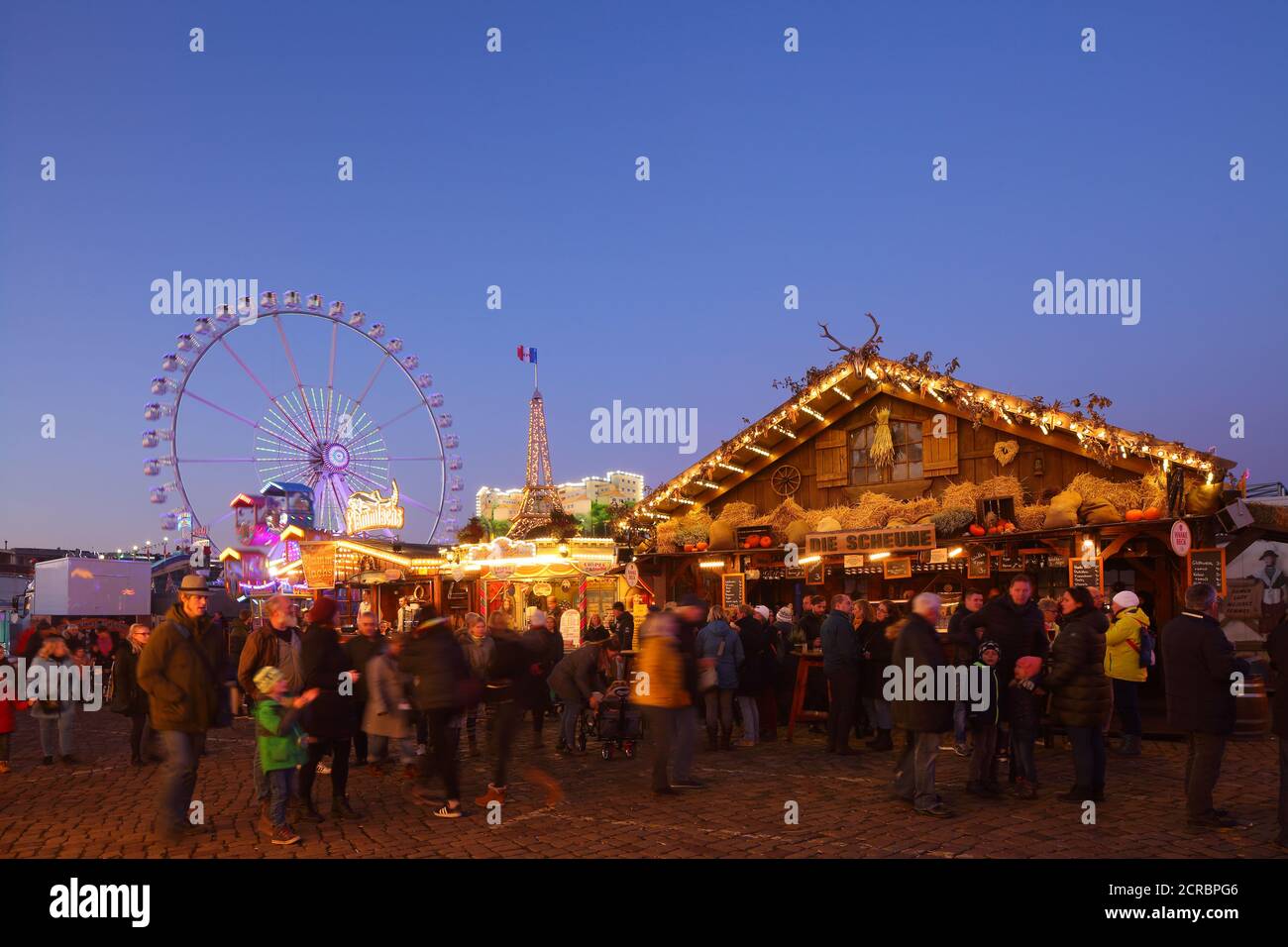 Ferris wheel and booths on the Bremer Freimarkt, Bremen, Germany ...