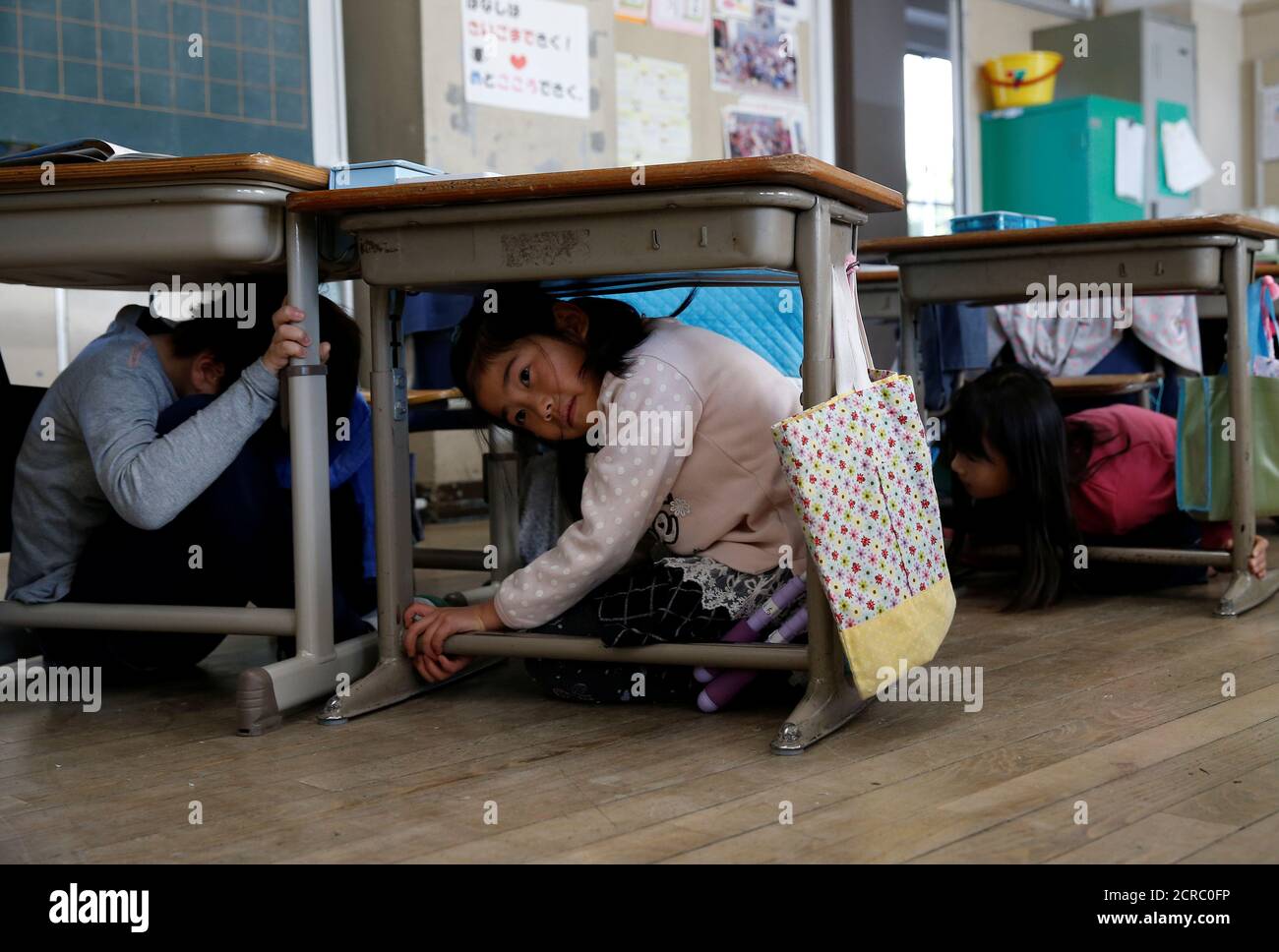 Japan children earthquake drill hi-res stock photography and images - Alamy