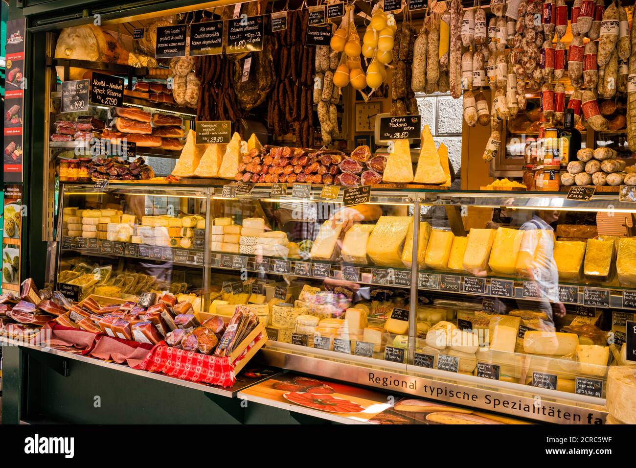 Bolzano, fruit market, ham, bacon and cheese Stock Photo - Alamy