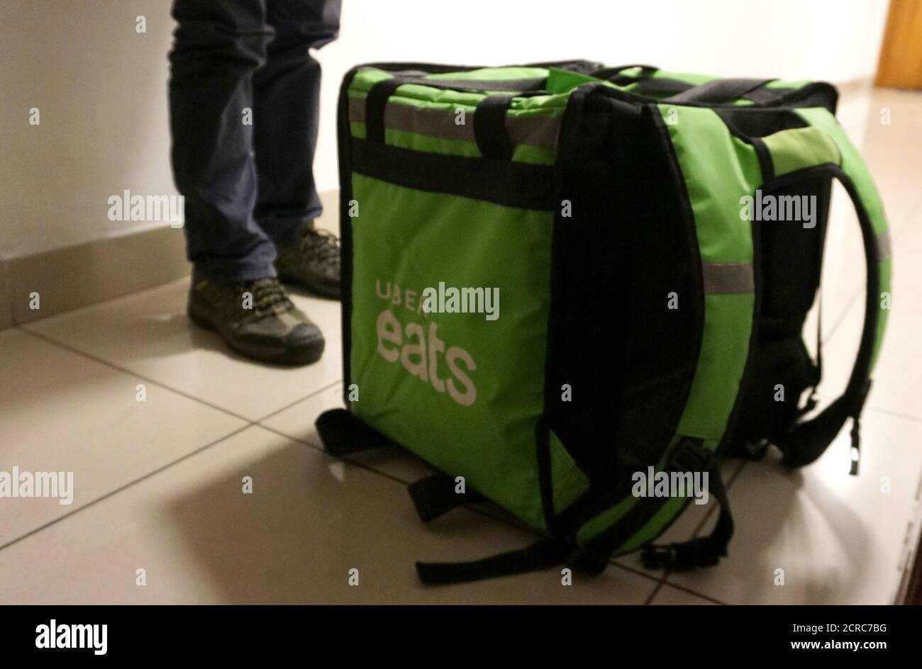 Food delivery uber eats worker hi-res stock photography and images - Alamy